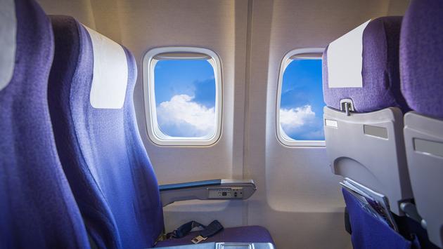 The Real Reason Behind Those Tiny Holes in Airplane Windows - AirGuide ...